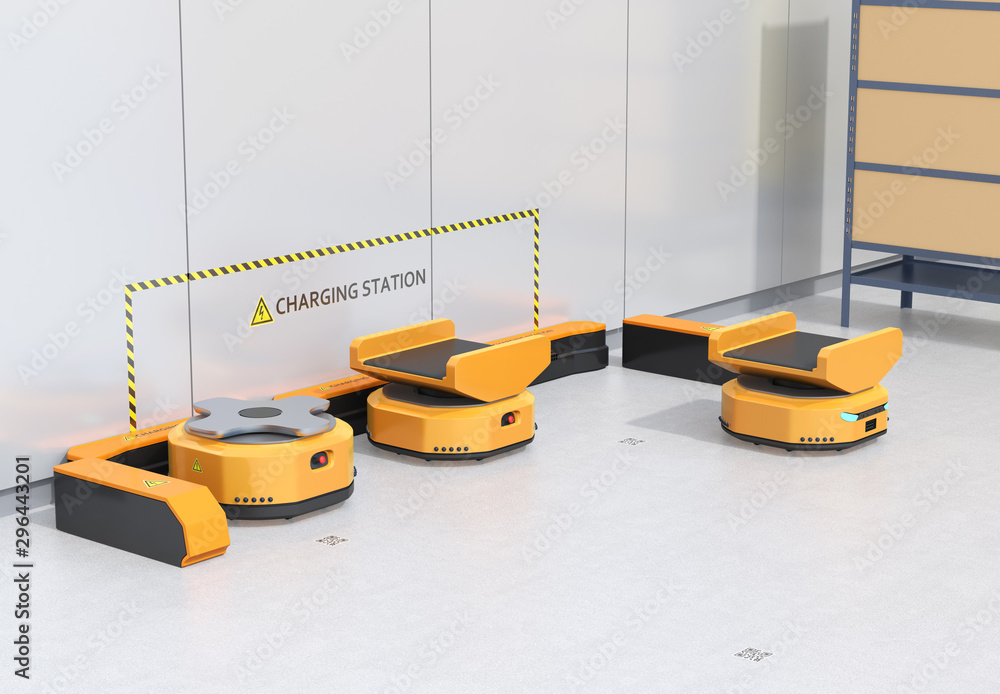 Autonomous Mobile Robots charging in modern warehouse. Warehouse ...