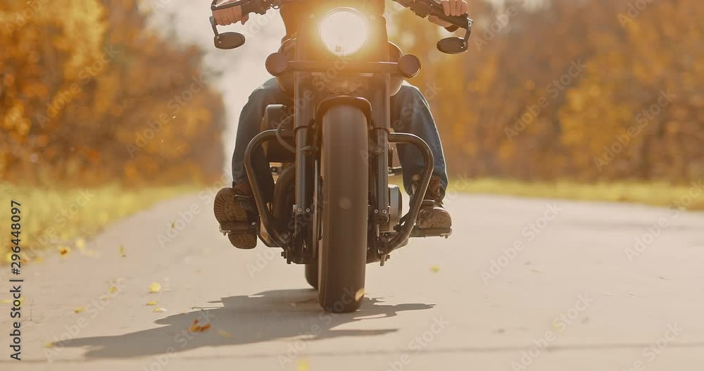 Motorcycle wheels close-up. Autumn road, leaves are flying. Stock ビデオ ...