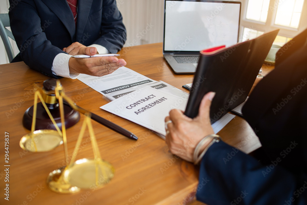 The lawyer is explaining the principles of law for people who come to ...