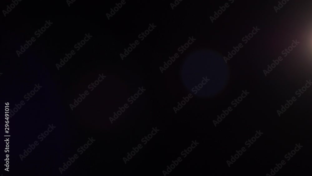 One lens flare light overlays. Sun is outside of side and outside of ...