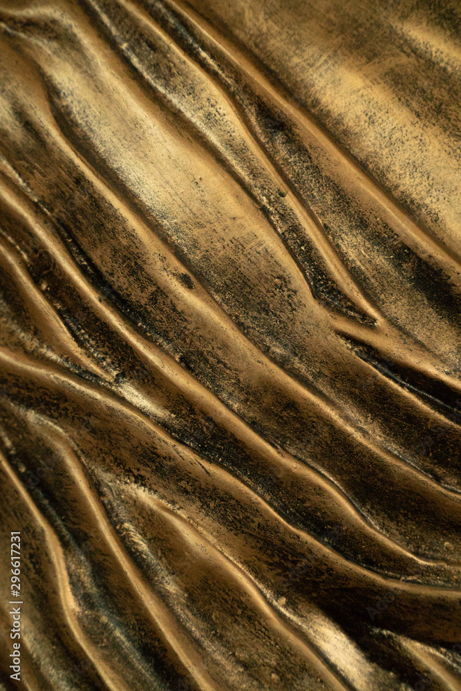 Classic sculpted statue of budhha with wet curtain technique. The ...