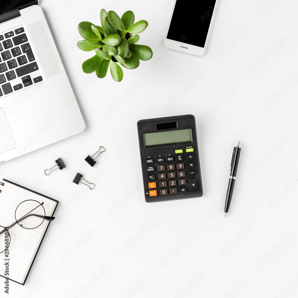 Elegant office desktop with calculator and accessories on white ...