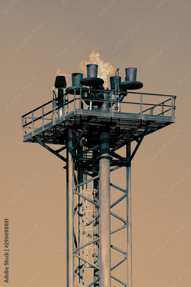 Tower at a natural gas storage facility with flames coming out of the ...
