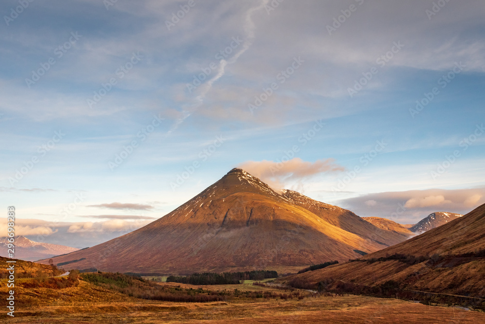 A pyramid-shaped mountain in the Scottish highlands as a low-hanging ...