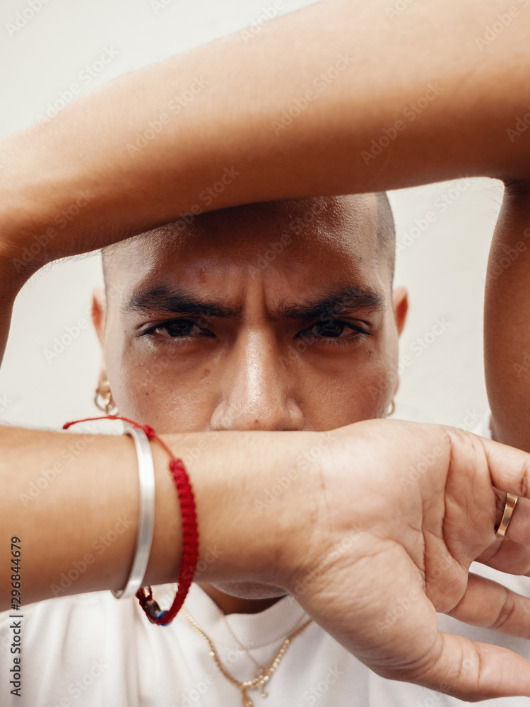 Portrait of man framing face with arms Stock Photo | Adobe Stock