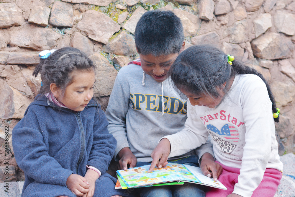 Native american kids reading a book. Stock Photo | Adobe Stock