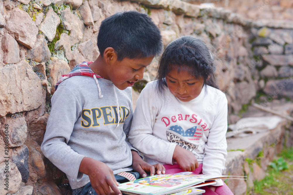 Native american kids reading a book. Stock Photo | Adobe Stock