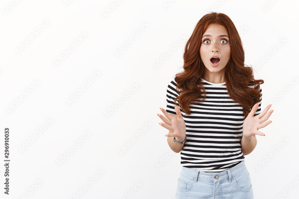 Excited and amazed nervous young redhead woman drop jaw, gasping with ...