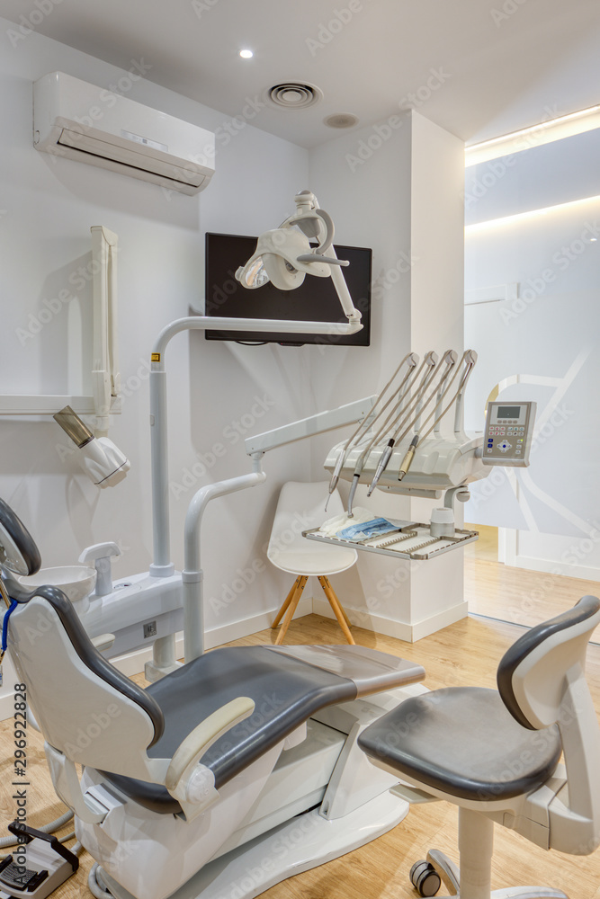Fully equipped modern dental clinic box, with white walls and wooden ...