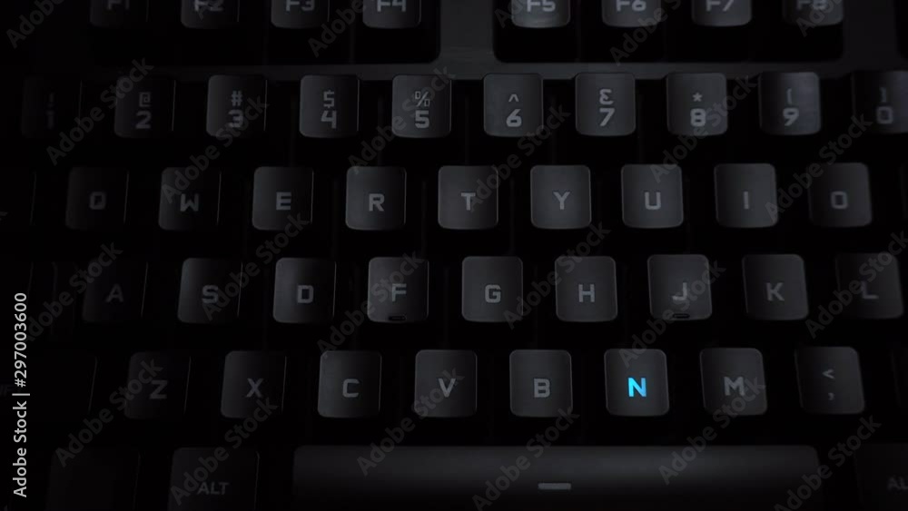 The word business is typed on a luminous computer keyboard. Black ...