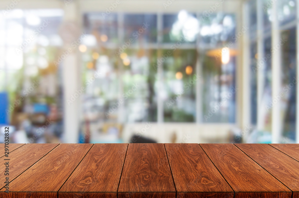 Wood table in blurry background of modern restaurant room or coffee ...