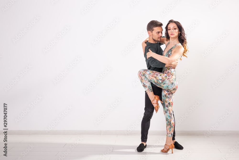Young couple dancing latin dance bachata, merengue, salsa, kizomba. Two ...
