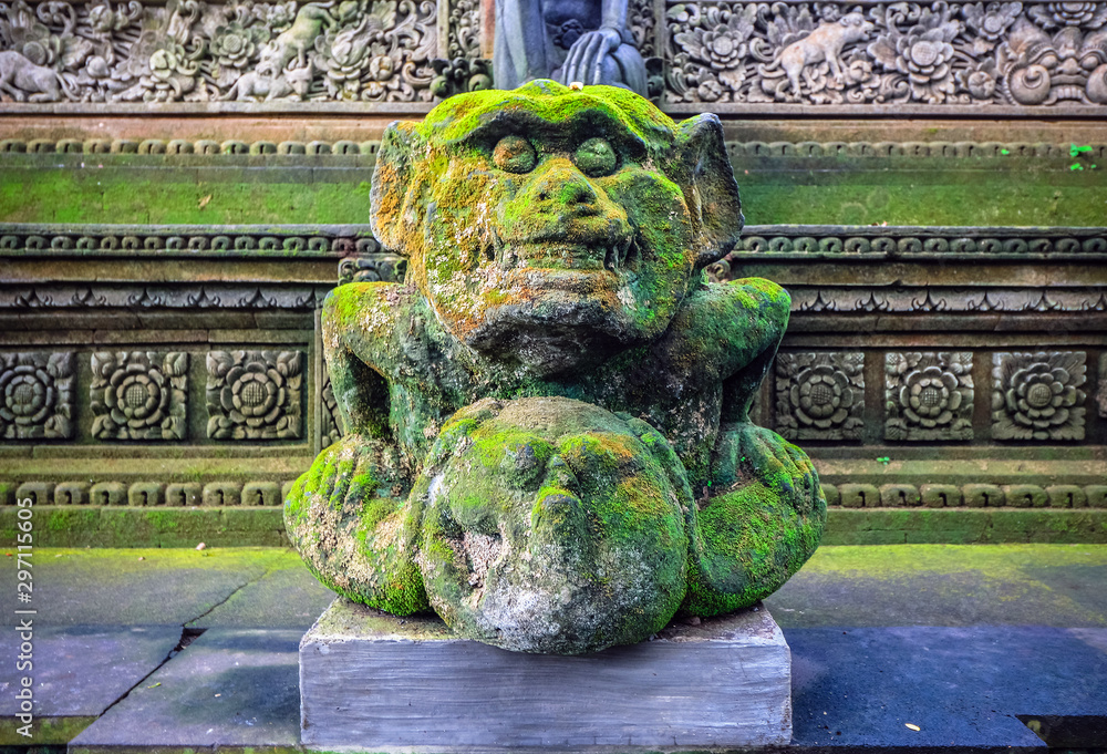 Balinese stone monkey statue in monkey forest Ubud Stock Photo | Adobe ...