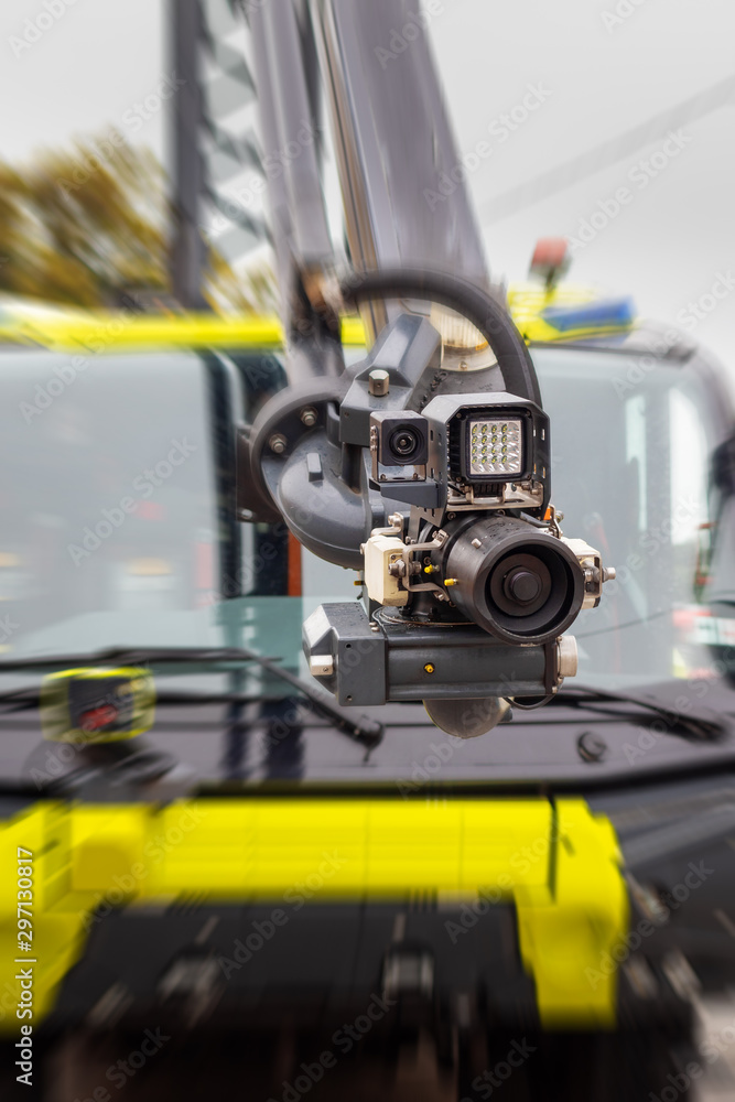 Modern firefighting system mounted on a hydraulic arm of a fire truck ...
