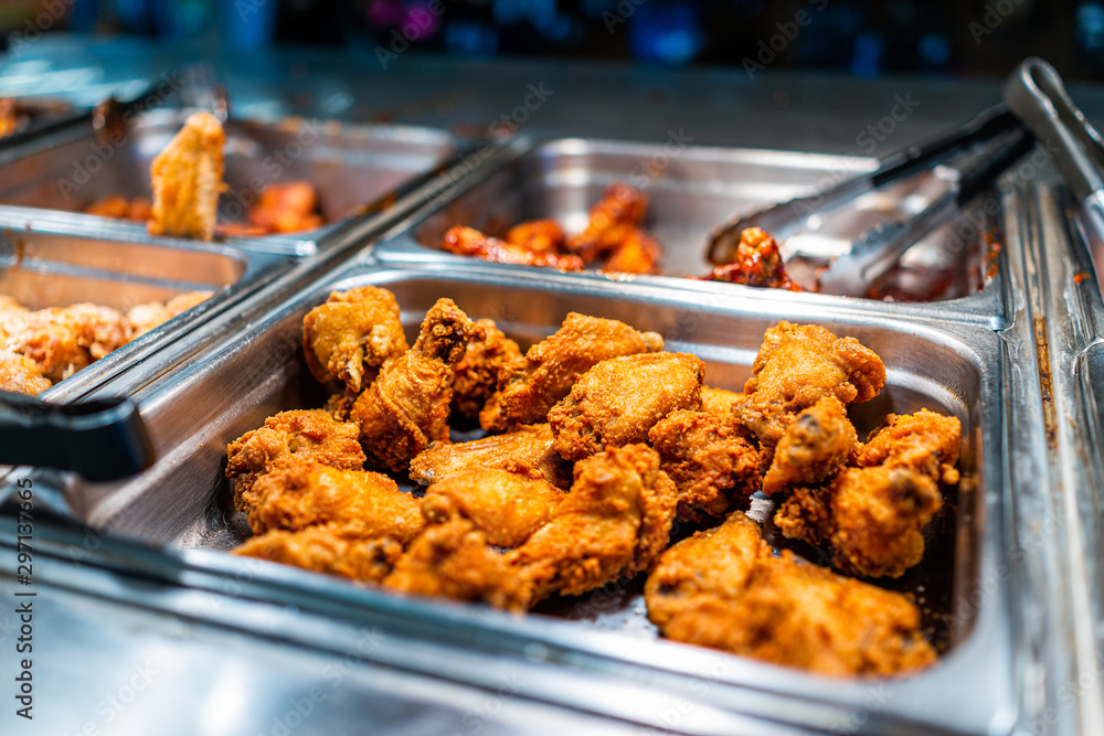 Fried chicken thighs buffet bar self serve with tongs in grocery store ...