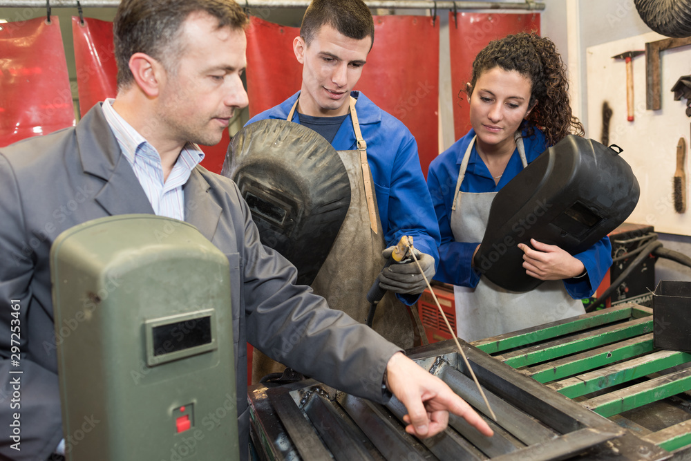 students of engineering studying and working together in workshop Stock ...