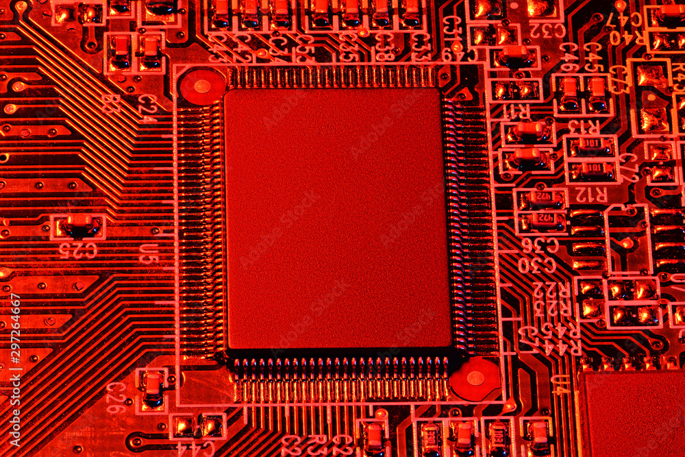 Foto Stock printed circuit board and microchip, or cpu, in red light ...