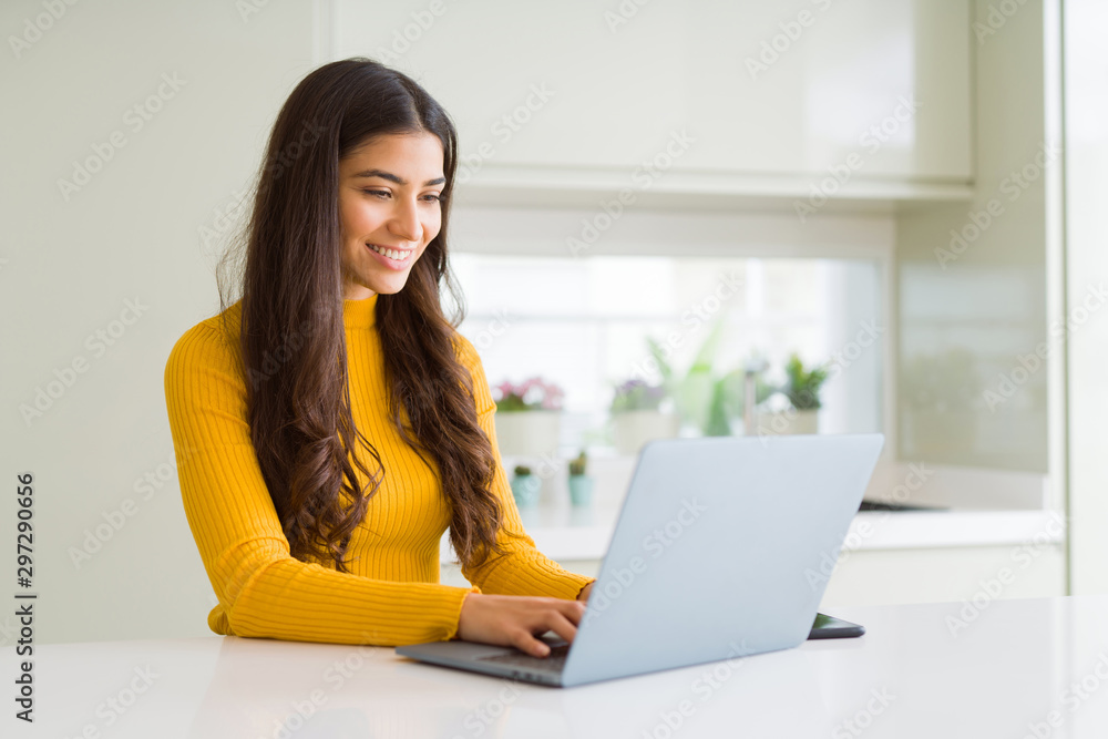 Beauitul young woman working using computer laptop concentrated and ...