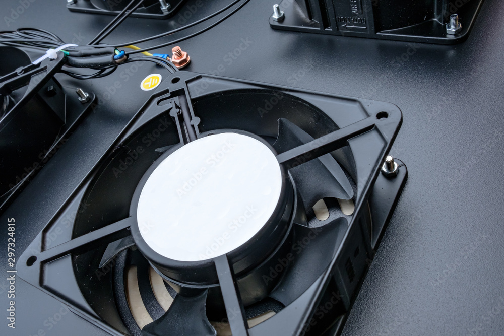Close-up view of electrical cooling fans seen attached to a data centre ...