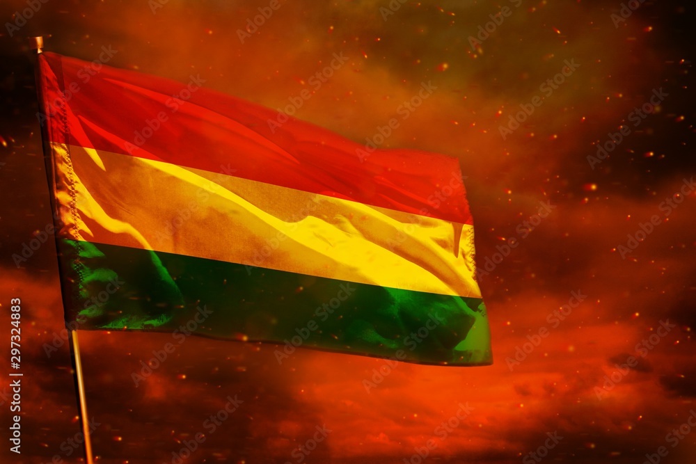 Fluttering Bolivia flag on crimson red sky with smoke pillars ...