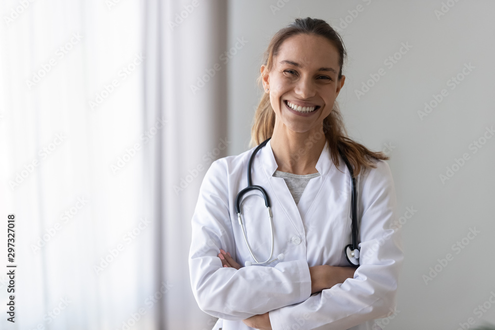 Portrait of smiling female nurse posing in hospital Stock Photo | Adobe ...
