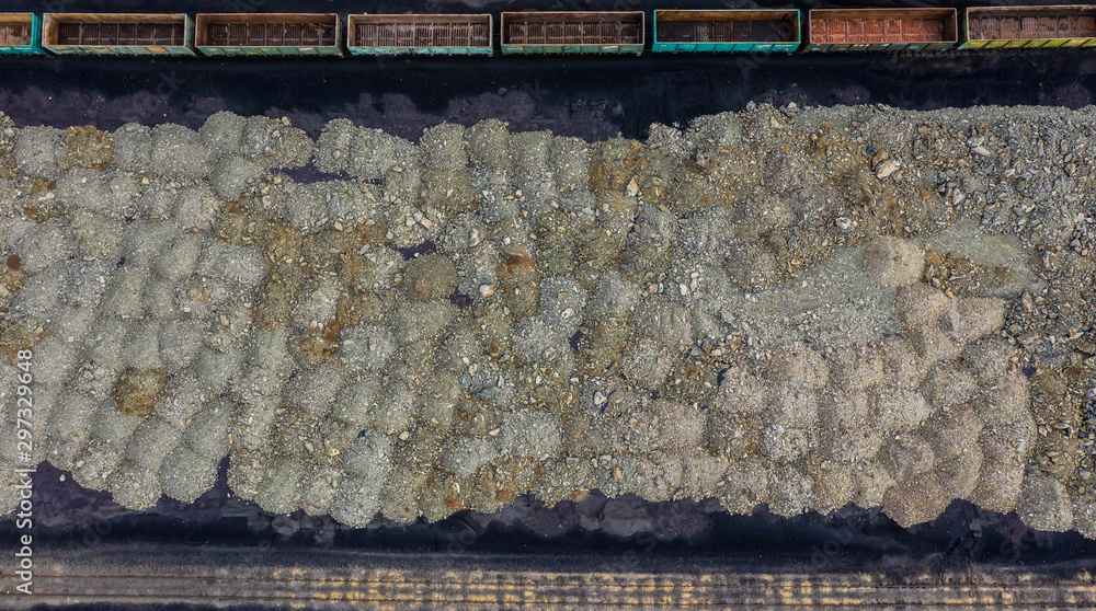top view of train cars unloading crushed stone at the open copper ...
