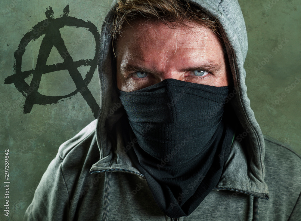young man as violent and ultra anarchist rioter . furious anti-system ...