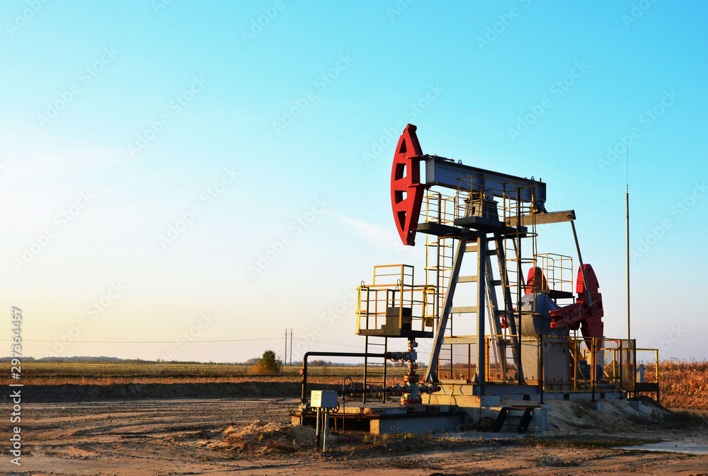 Oil drilling derricks at desert oilfield. Crude oil production from the ...