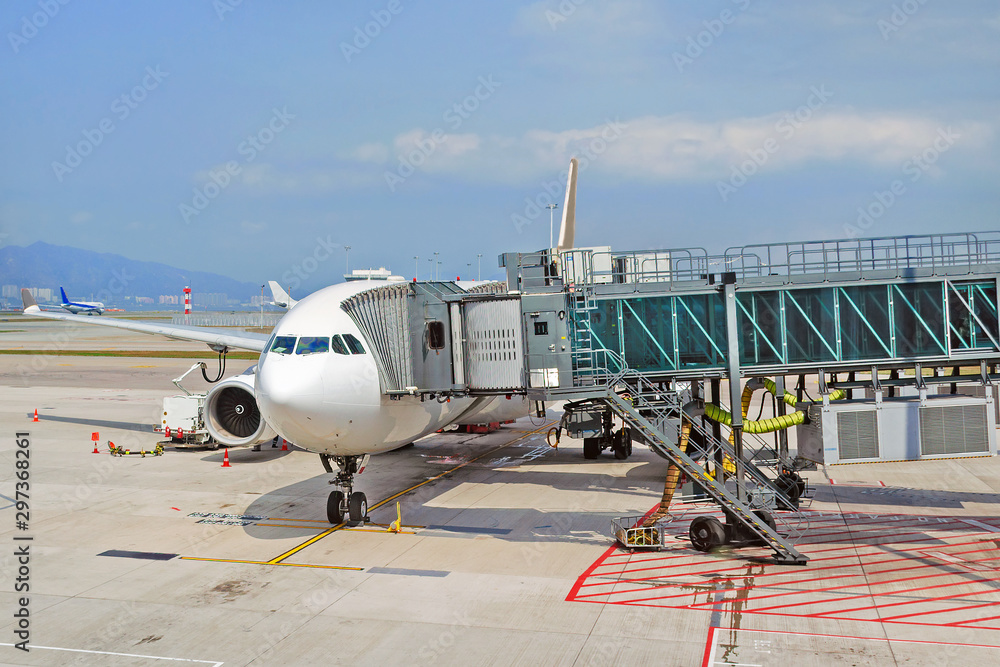 Plane with jet bridge for passengers at airport Stock Photo | Adobe Stock