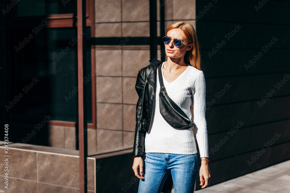 Stylish model girl at the city in black leather jacket and white ...