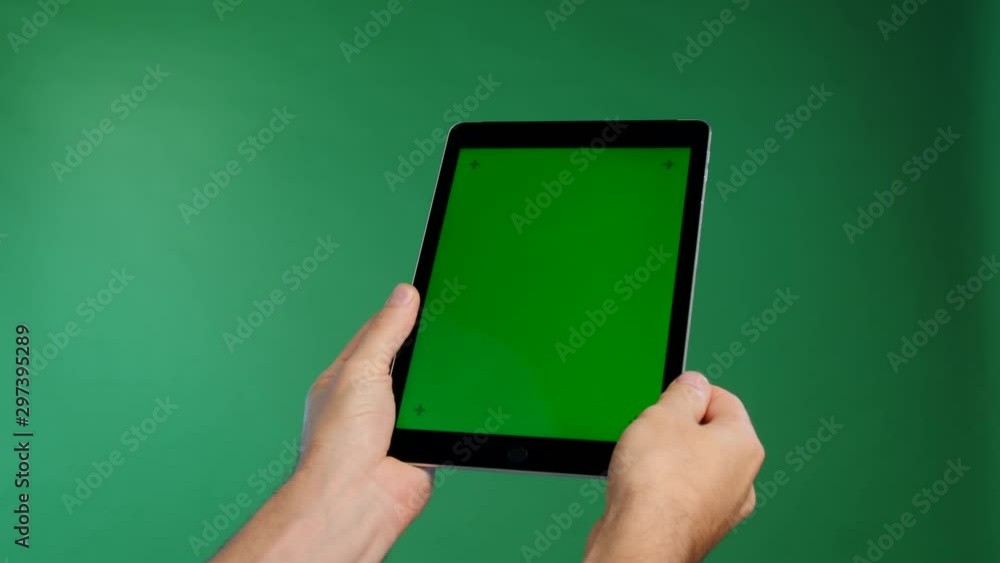Pen holding a smart tablet or a pad in hand and doing tapping gestures ...