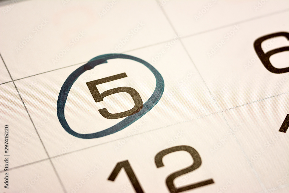 the fifth day of the month highlighted on the calendar with a frame ...