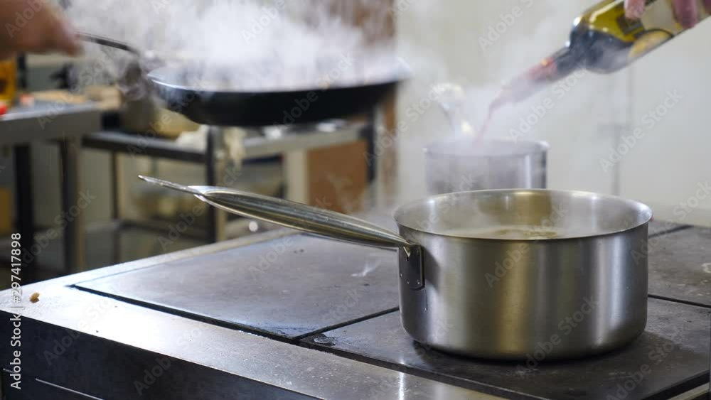 Busy restaurant kitchen concept. Team of chefs and kitchen staff ...