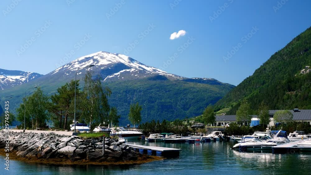 Beautiful boat marina harbor at Valldal, Norway on the calm waters of a ...