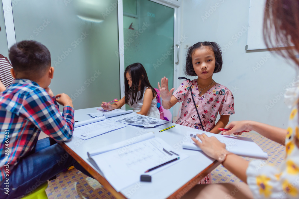 Asian elementary school students are studying mathematics in the ...