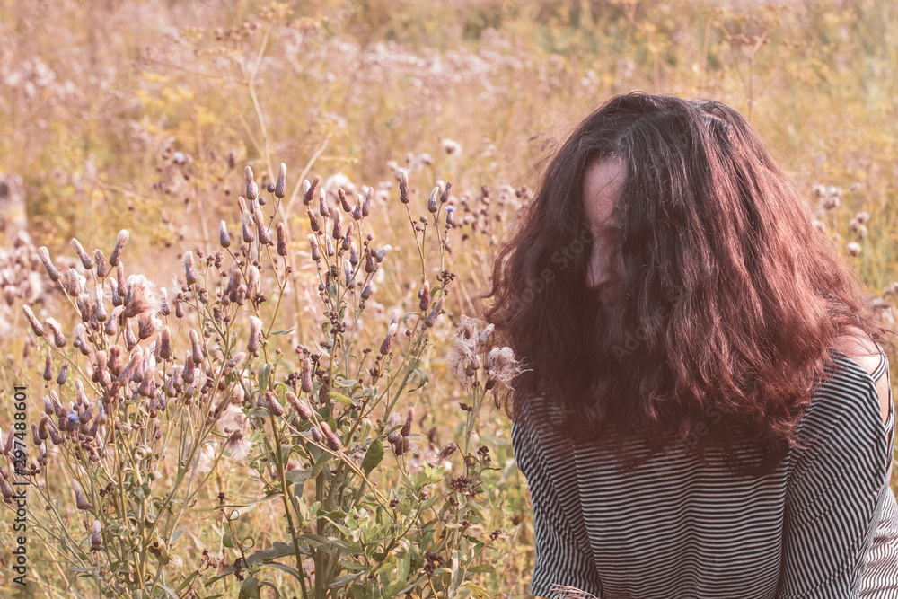 Sad Girl In Field Of Flowers