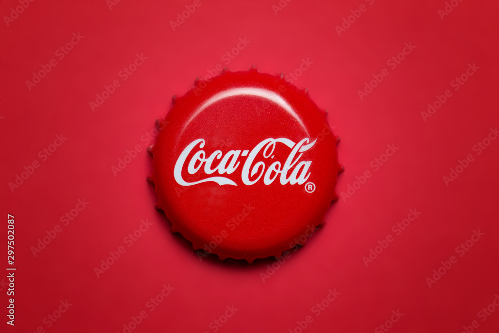 classic cap close-up of Coca-Cola on a red background. Stock Photo ...
