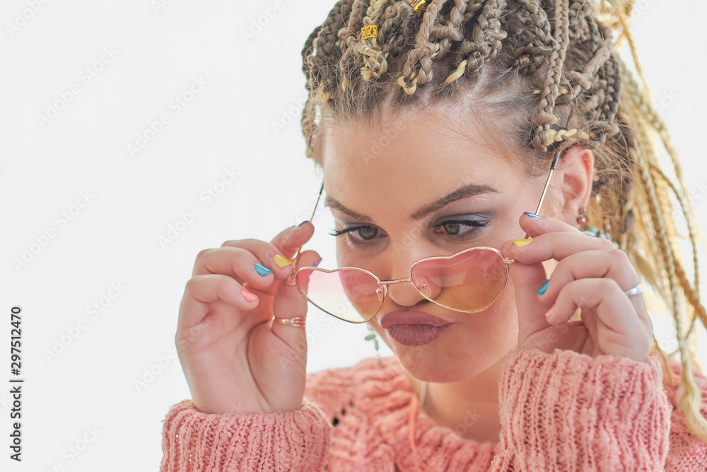silly young woman making funny faces. Close up studio portrait of ...