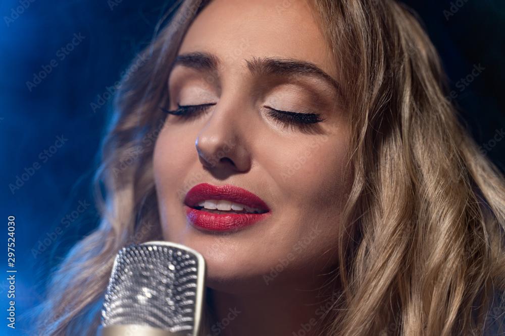 Beautiful Girl Singer Sings On Stage With Illumination Into Microphone ...