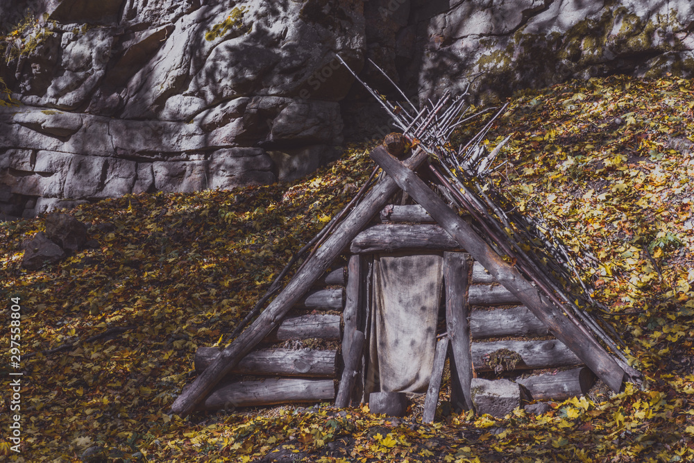 Dugout (or dug-out, pit-house, earth lodge, cellar dug) from logs in ...