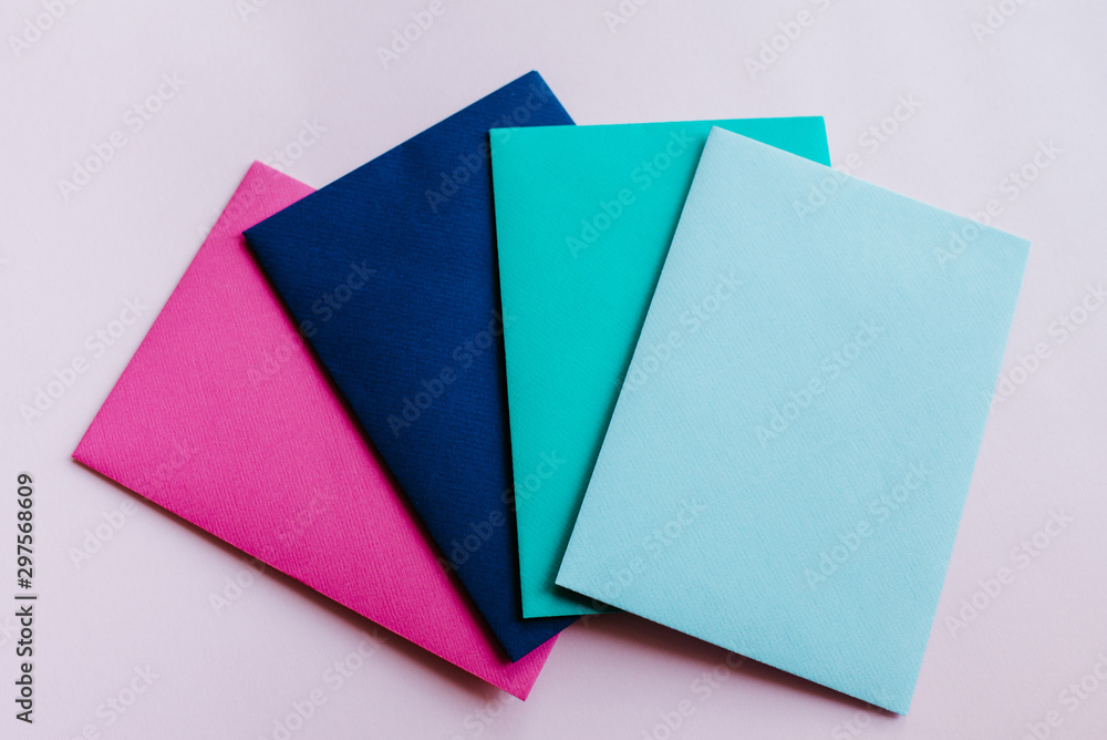 Colored paper envelopes on a light background. New mail, write message ...