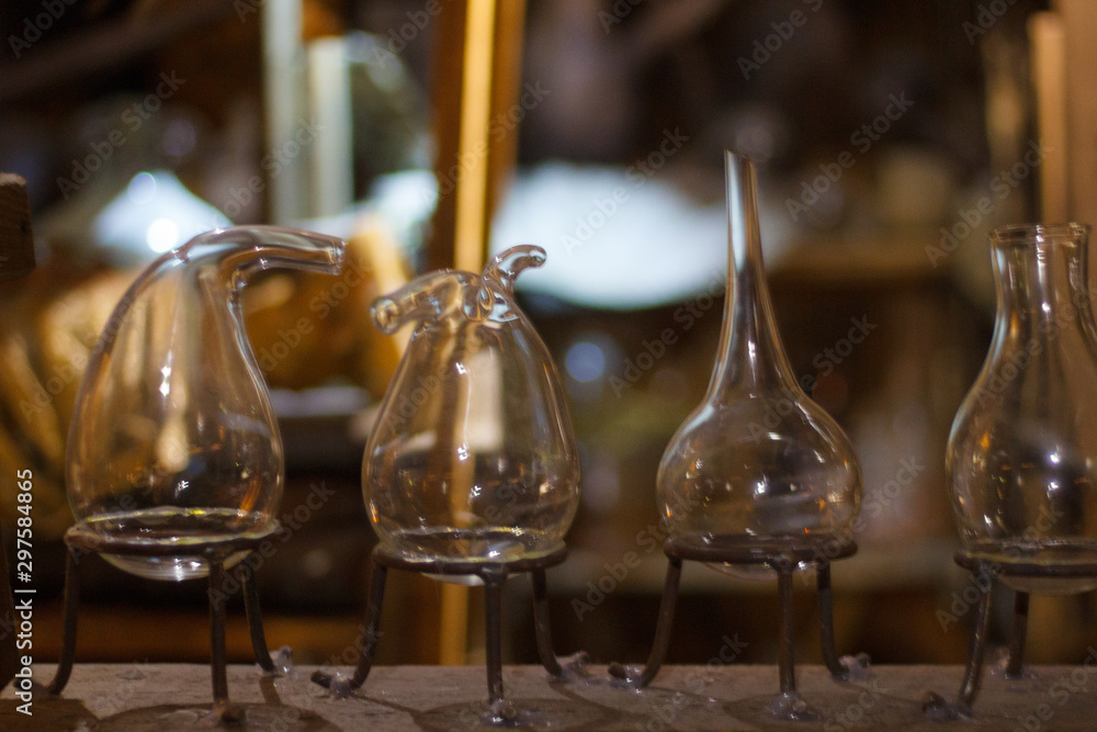 Set of alchemy bottles in laboratory of alchemist. Herb in old pots ...