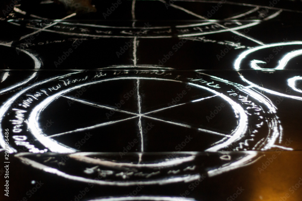 Black floor with alchemy symbol. Mysterious scheme on dark background ...