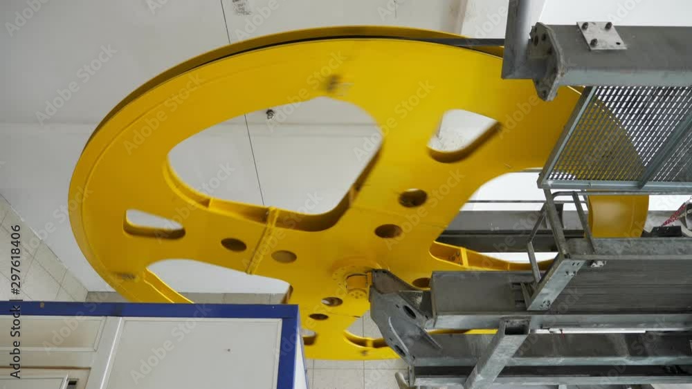 powerful yellow mechanism wheel rotates driving cable car and ...