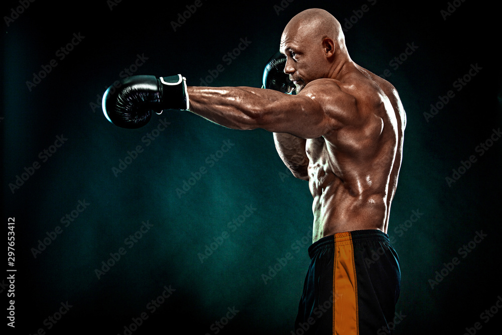 Sportsman, man boxer fighting in gloves on black background. Fitness ...