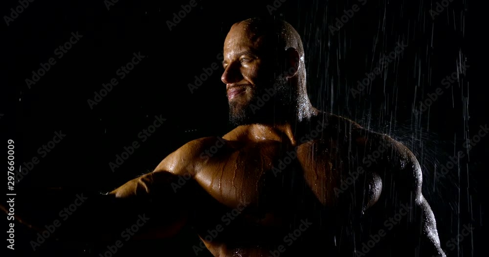 Portrait of a brutal muscular bald bearded male bodybuilder close-up on ...