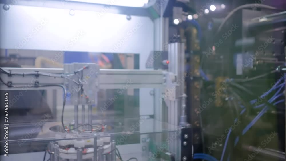 Plastic injection molding machine: automatic robotic arm manipulator ...