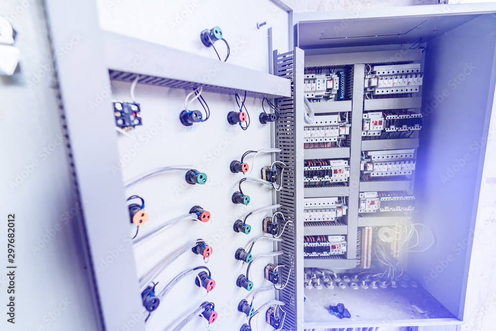 Electrical panel at a assembly line factory. Controls and switches ...