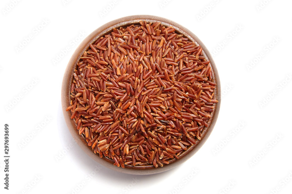 Red rice in a brown wooden bowl isolated on white background. Dry ...