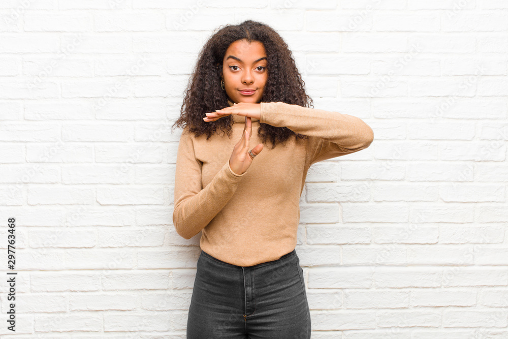young black woman looking serious, stern, angry and displeased, making ...